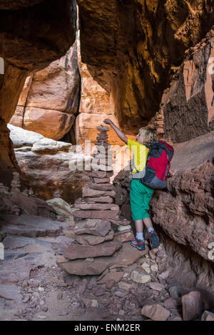 A young girl backpacking in the Needles District of Canyonlands ...