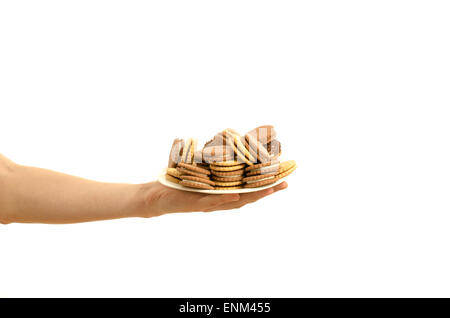 Man's hand offering chocolate, cupcakes, biscuits, cookies, muffins and ...