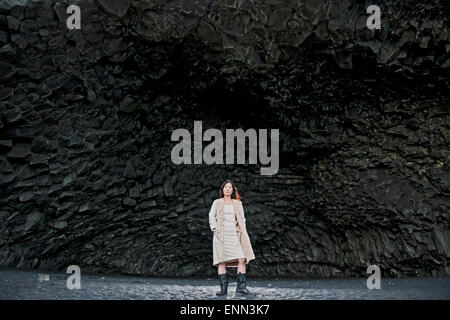Korean woman standing in basalt cave Stock Photo - Alamy