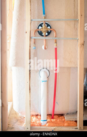 Rough plumbing in new home construction Stock Photo - Alamy
