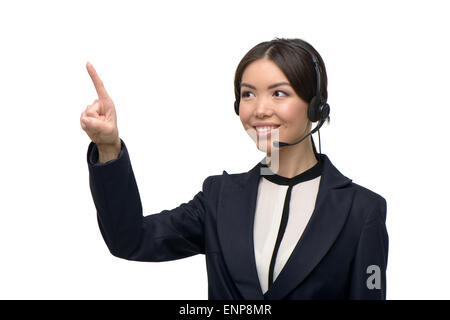 Smiling telephone operator with headphones pointing at you Stock Photo ...