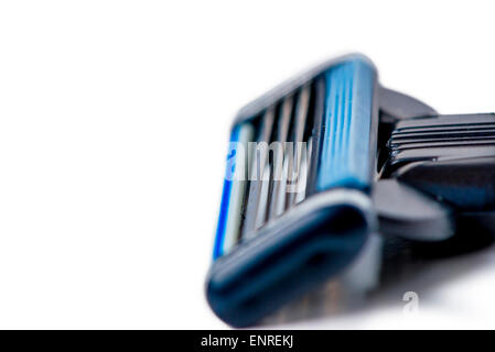 Shaving machine with three blades on a blue background with water drops ...