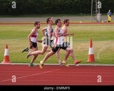 Runners sprint to the finish line in a heat of the men's 1,500-meters ...