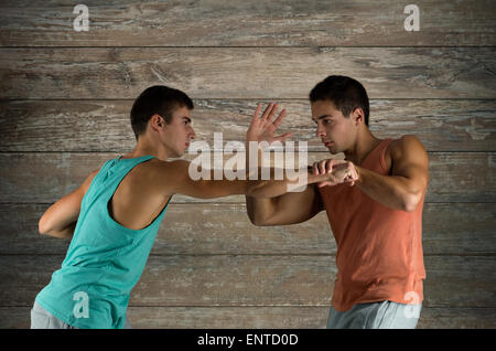 young men fighting hand-to-hand Stock Photo - Alamy