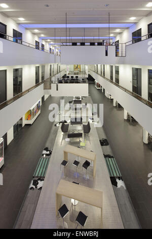 Atrium with desks at dusk. IBC Kolding Campus, Kolding, Denmark ...