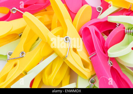 Pegs of various colors arranged as background Stock Photo - Alamy