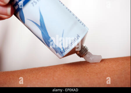 Ointment is applied to an arm Stock Photo - Alamy