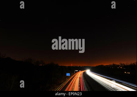 Lights of traffic on the M1 Motorway at night Northamptonshire England ...