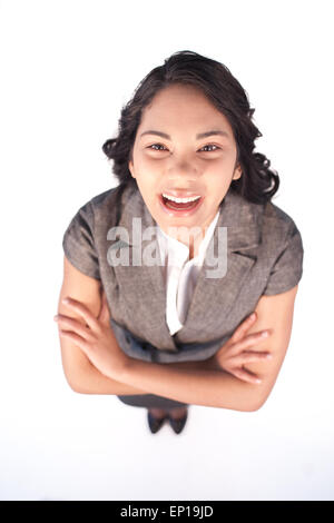High angle of brunette businesswoman laughing at the camera Stock Photo ...