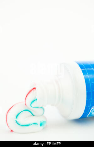 Multicolour toothpaste outgoing of a tube of toothpaste Stock Photo - Alamy