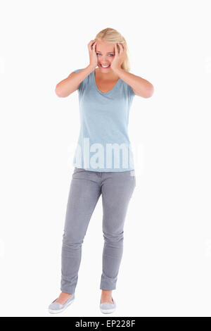 Embarressed blond woman Stock Photo - Alamy