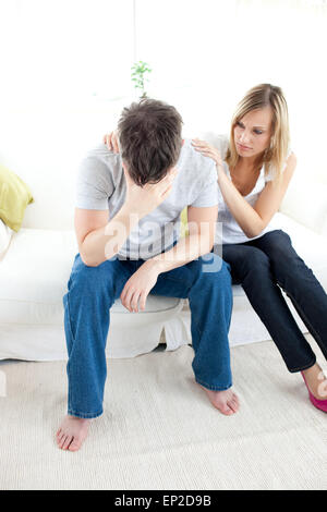 Tired couple having an argue in the living-room Stock Photo - Alamy