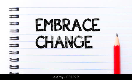 Embrace Change Text written on notebook page, red pencil on the right ...