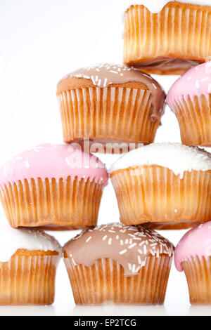Close up on eight muffins with icing sugar placed in pyramid Stock ...
