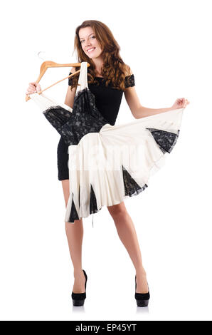 Young attractive woman trying new clothes in front of mirror among ...