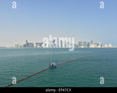 The skyline of Doha, Qatar, on a blue sky day, winter time, seen from ...