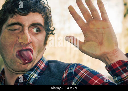 Crazy lunatic man smooshes face against glass surfaces Stock Photo - Alamy