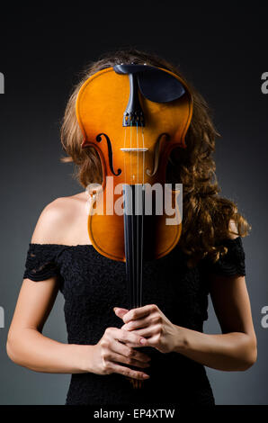 Attractive woman with cello in studio Stock Photo - Alamy