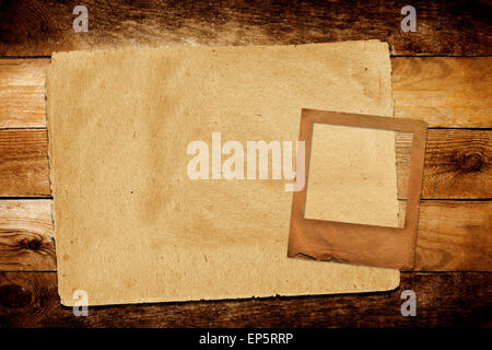 Old grunge paper slide on the wooden background Stock Photo - Alamy