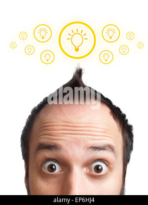 Funny young man with light bulb over his head Stock Photo - Alamy