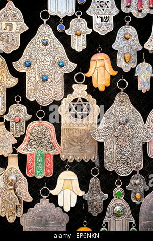 Silver and brass pendants, Hands of Fatima, good luck charms in a ...