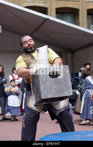 Basque rural sports. Harrijasotzaile, stone lifting, in the Santo Tomas ...