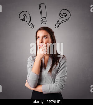 Young lady thinking with question marks overhead Stock Photo - Alamy