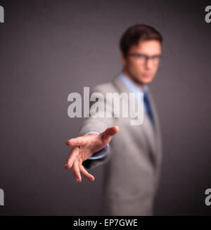 Young man standing and throwing something Stock Photo - Alamy