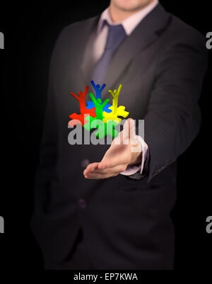 Businessman presenting human forms with raised arms Stock Photo - Alamy