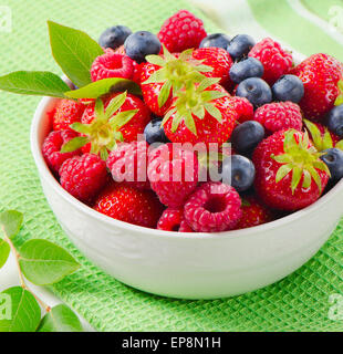 Delicious fresh berry mix on white background Stock Photo - Alamy