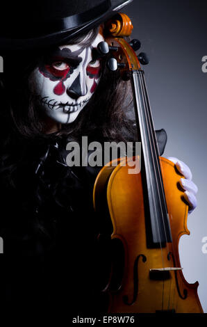 Devil or monster playing instrument. Halloween party concept. Man ...