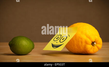 Lemon with post-it note watching at citrus fruits Stock Photo - Alamy