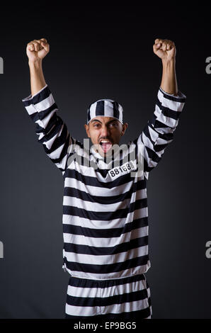 Angry prison inmate in dark room Stock Photo - Alamy