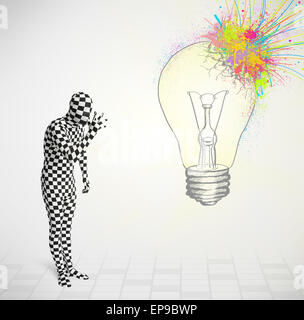 businessman drawing colorful light bulb Stock Photo - Alamy