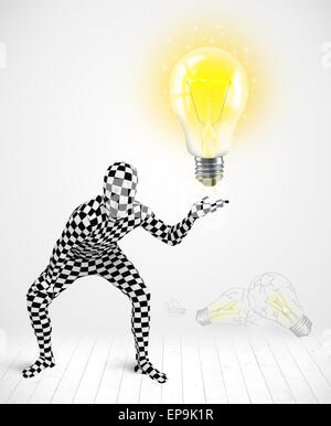Man in full body with glowing light bulb Stock Photo - Alamy