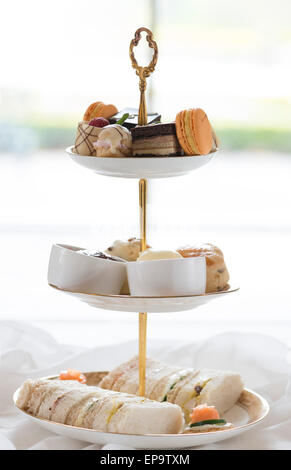 Afternoon tea with cakes, scones and finger sandwiches Stock Photo - Alamy