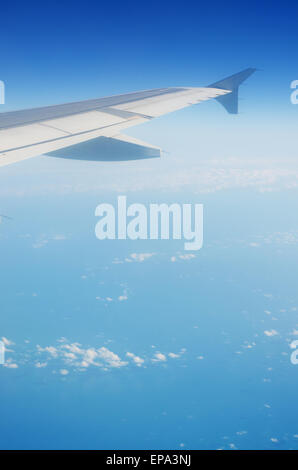 Airplane wing out of window Stock Photo - Alamy
