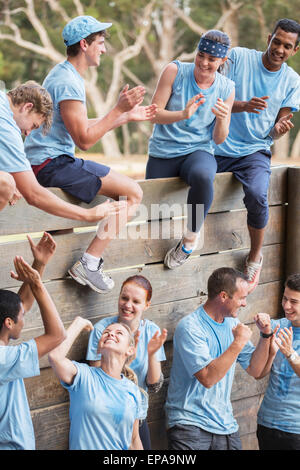Team building. Group of happy people holding hands outdoors Stock Photo ...