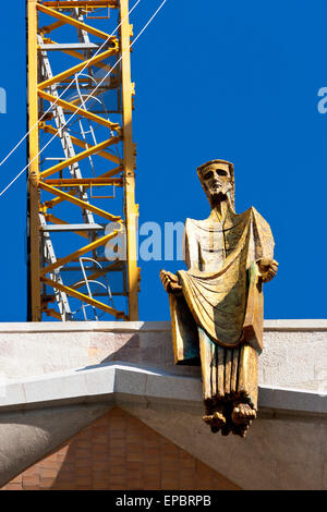 Sagrada Familia cathedral Jesus christ crucified statue with beautiful stained glass and steel ...