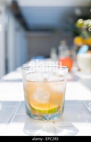 Fresh drink with lime on a sunny day outside Stock Photo - Alamy