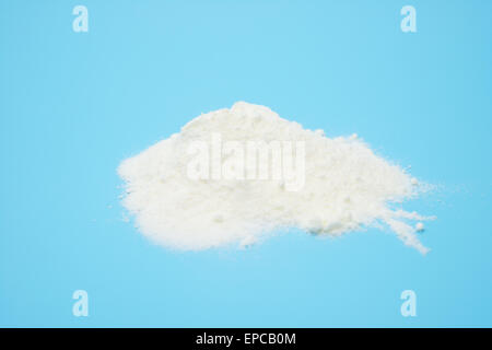 powdered milk on blue background with copy space Stock Photo - Alamy