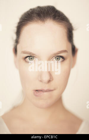 Portrait of a beautiful girl with a defiant make-up. White background ...