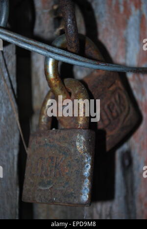 Two padlocks which are locked together Stock Photo - Alamy