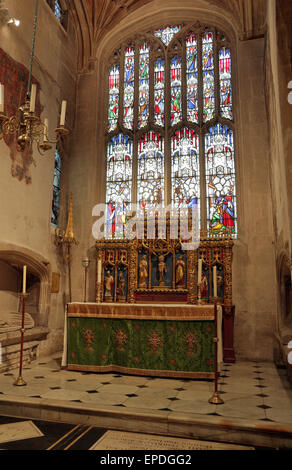 Side altar with colourful window, town parish church of St. Peter and ...
