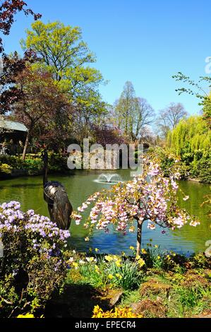Bird statue on the edge of the pond in the Dingle formal gardens in ...