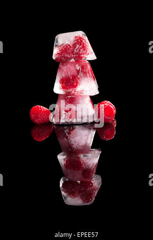 Ice cubes isolated on black background Stock Photo - Alamy