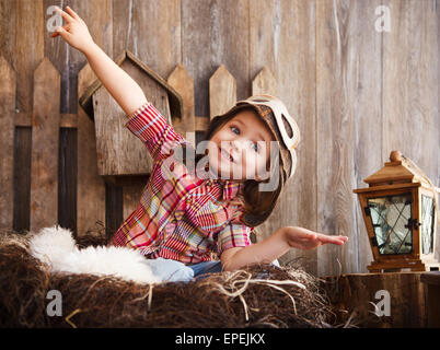 Happy kid playing in pilot helmet pretend to be aviator. Travel ...