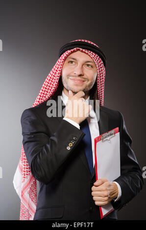 Arab man with paper binder Stock Photo - Alamy