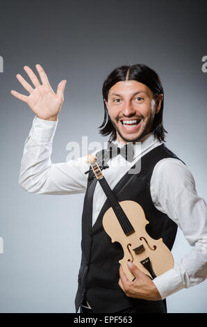 Funny fiddle violin player in musical concept Stock Photo - Alamy