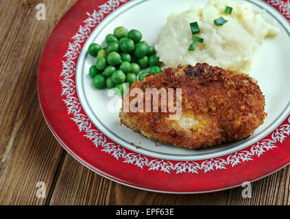 Kotlet schabowy - Polish variety of pork breaded cutlet coated with ...